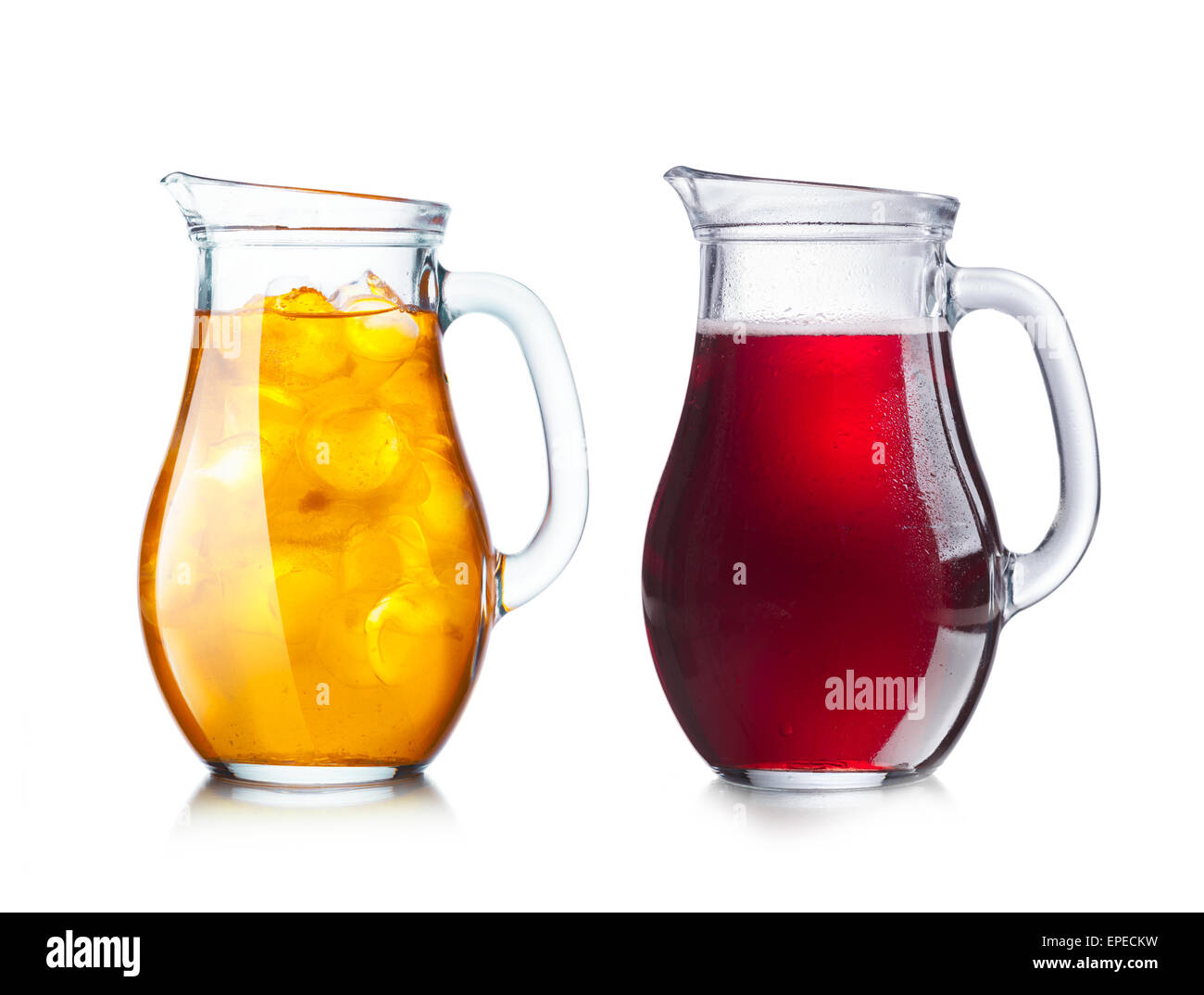Two pitchers (jugs) with transparent and opaque liquids of dark and ...