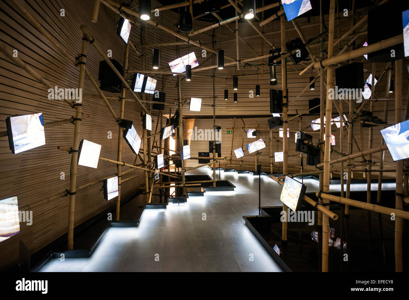 Exhibition hall with irregular arrangement of multimedia screens. Milan ...