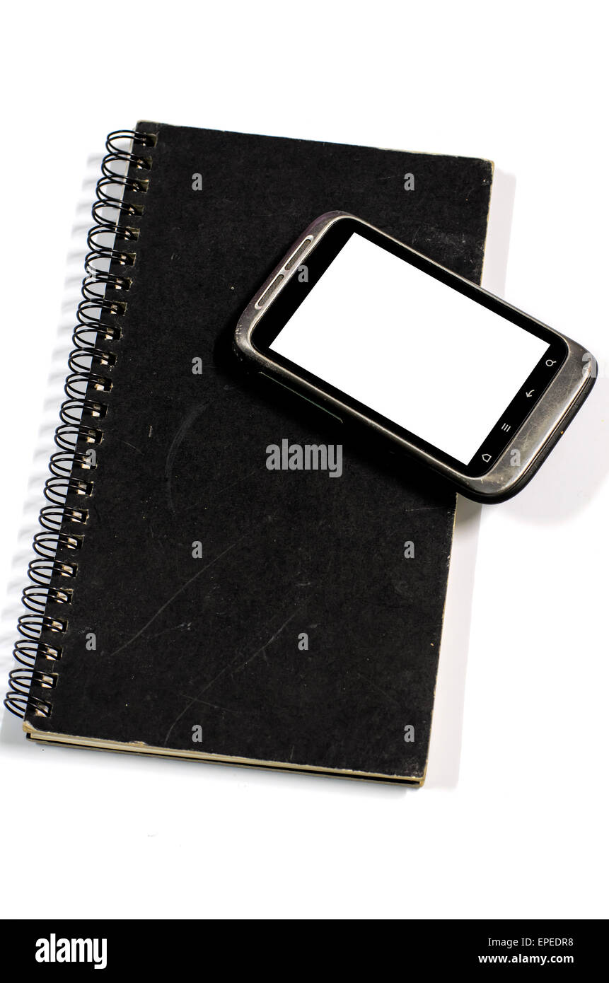 smartphone on note book on a white background Stock Photo - Alamy