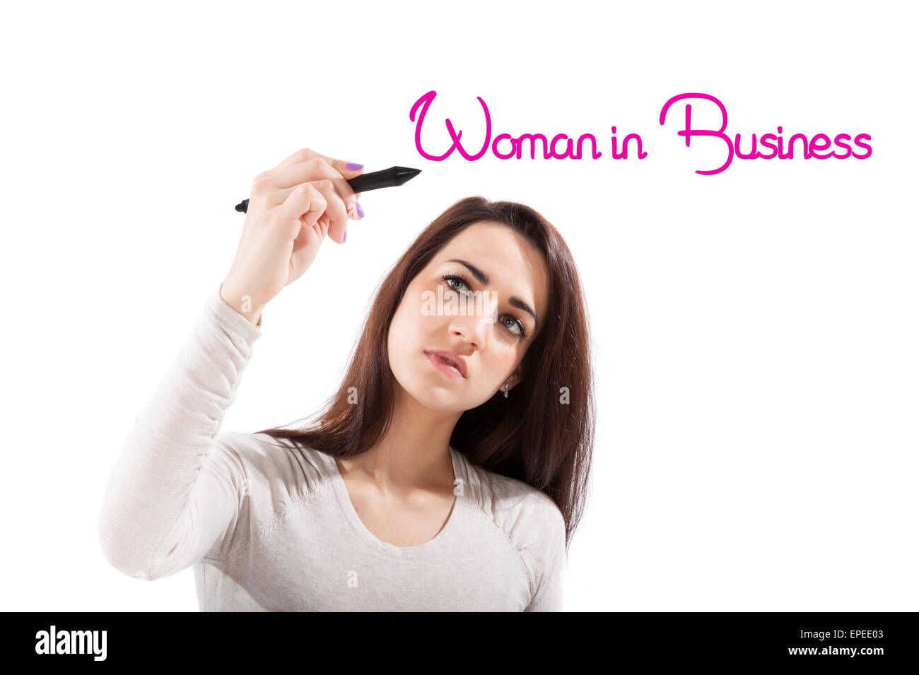 Beautiful girl writing with pink marker pen on virtual screen the ...