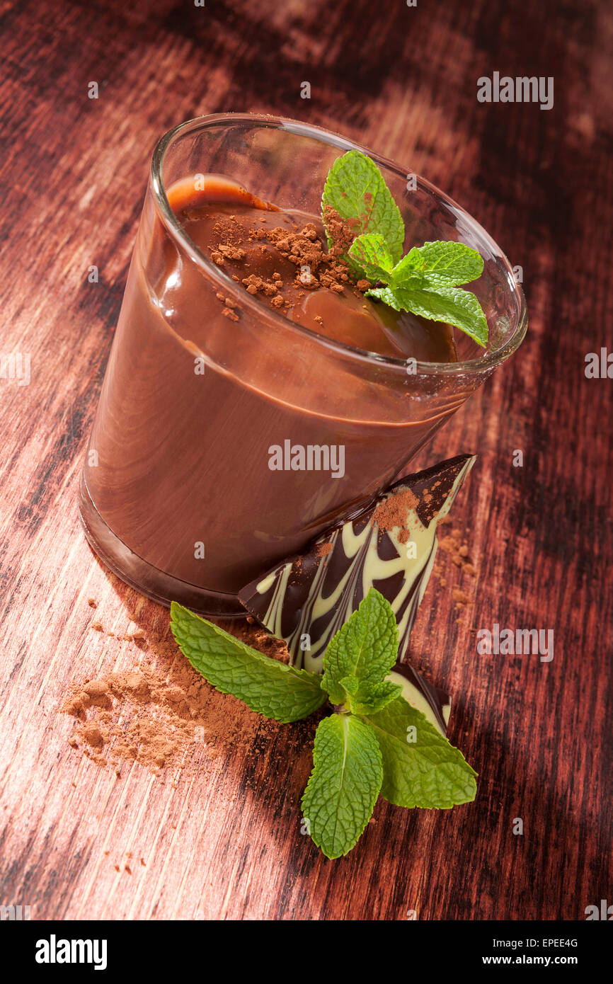 Delicious chocolate pudding with cocoa powder, chocolate bar and fresh ...