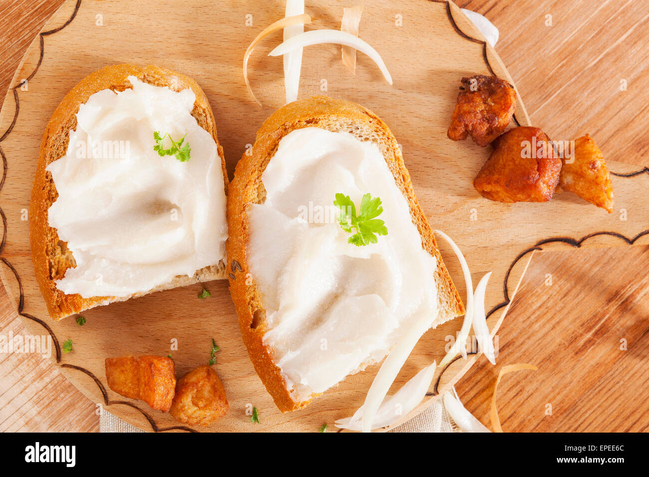 Delicious bread slices with lard and scratchings on vintage wooden ...