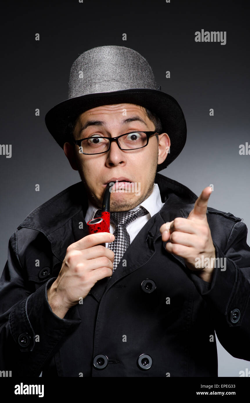 Funny detective with pipe and hat Stock Photo - Alamy