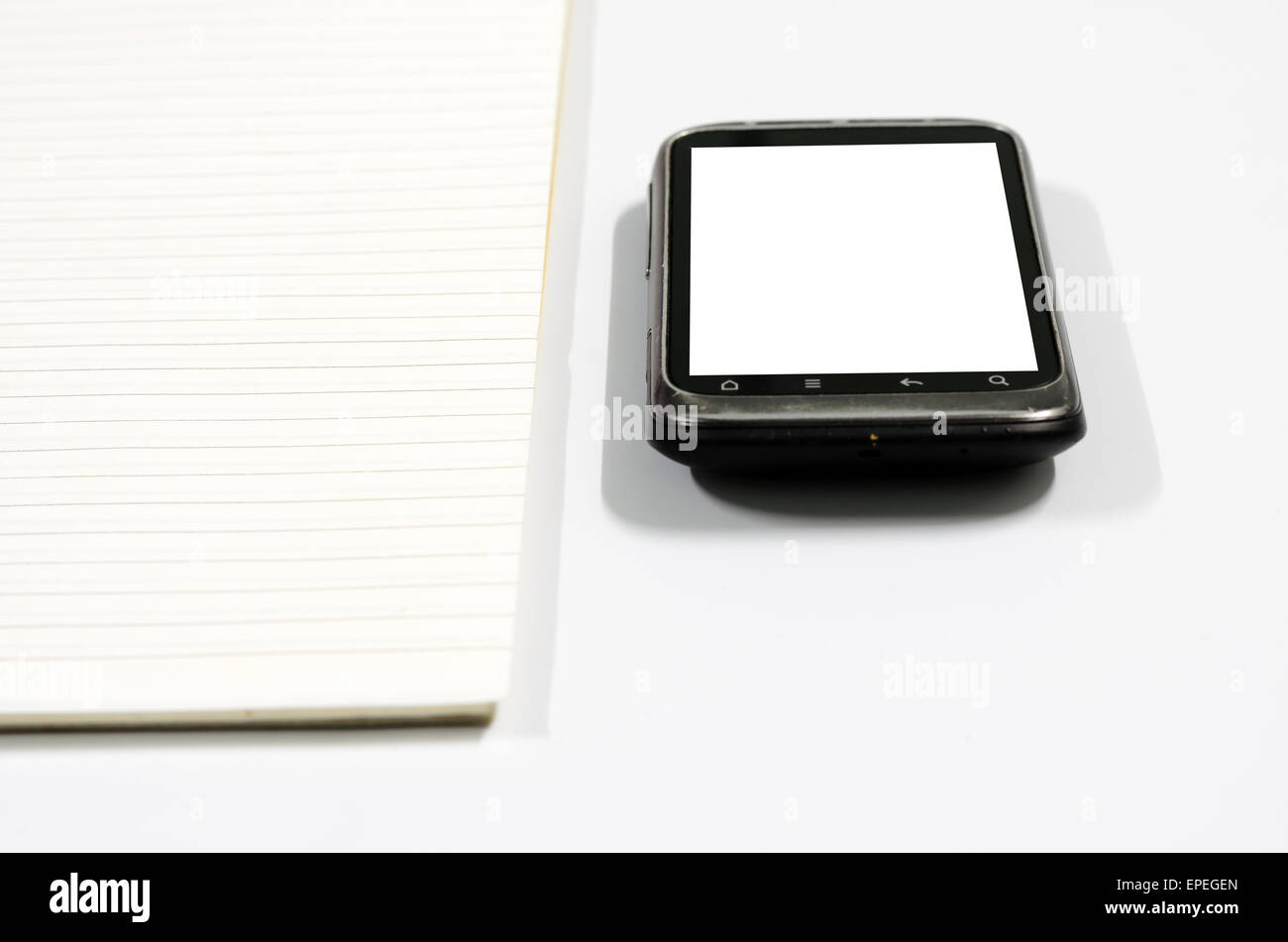 smartphone with note book on a white background Stock Photo - Alamy