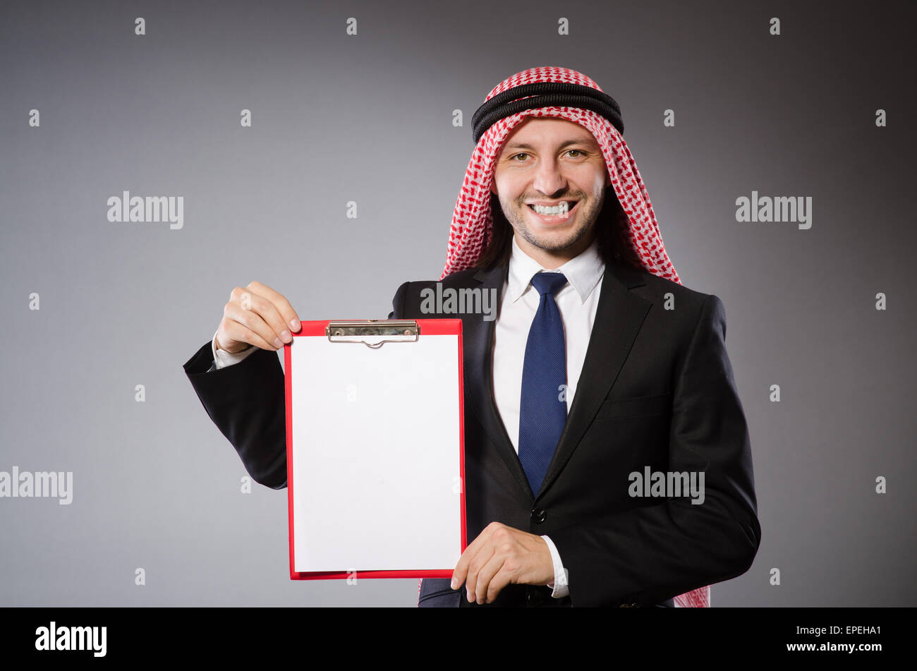 Arab man with paper binder Stock Photo - Alamy