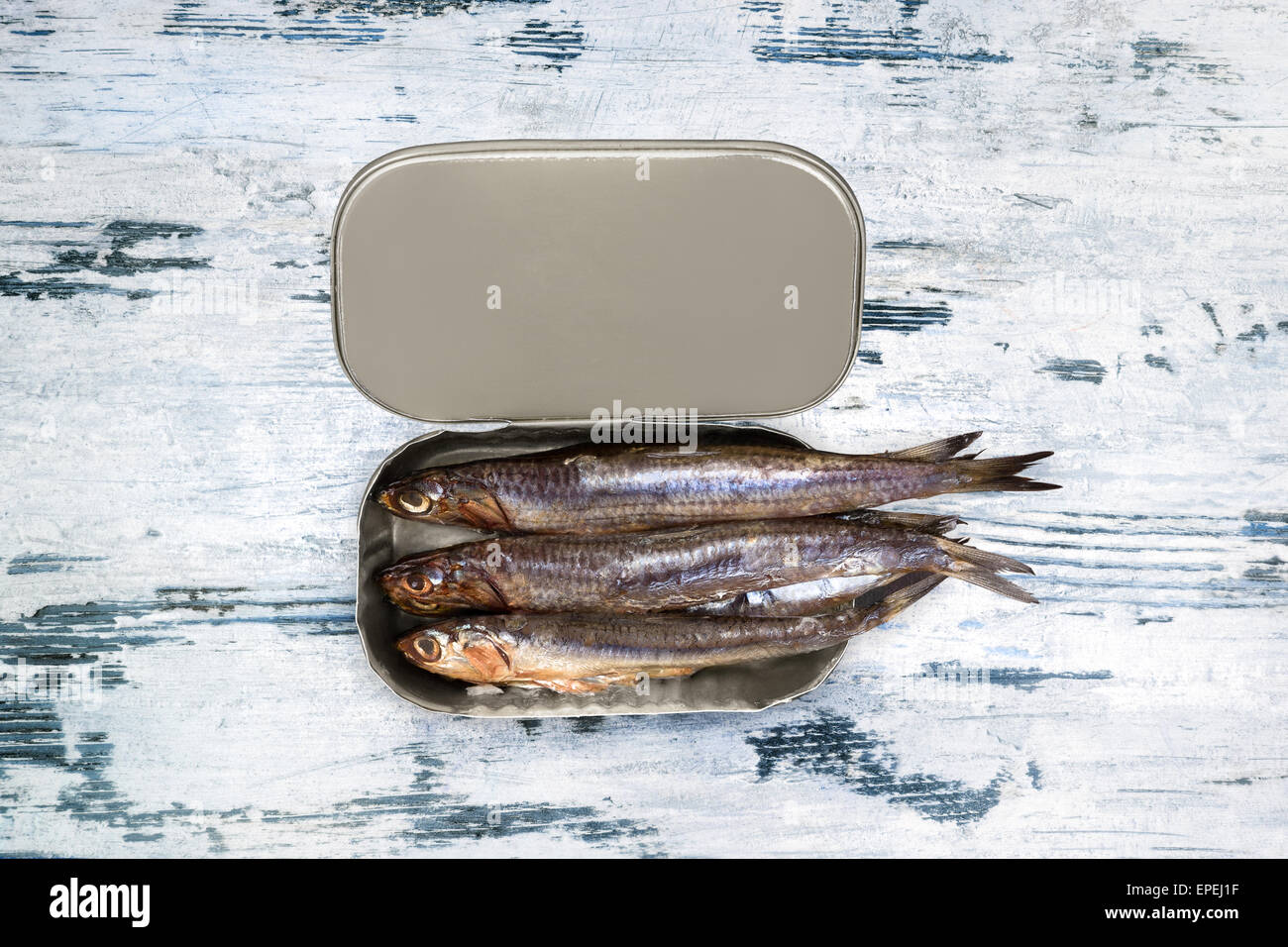 Mediterranean seafood background. Sardines in can on blue and white ...