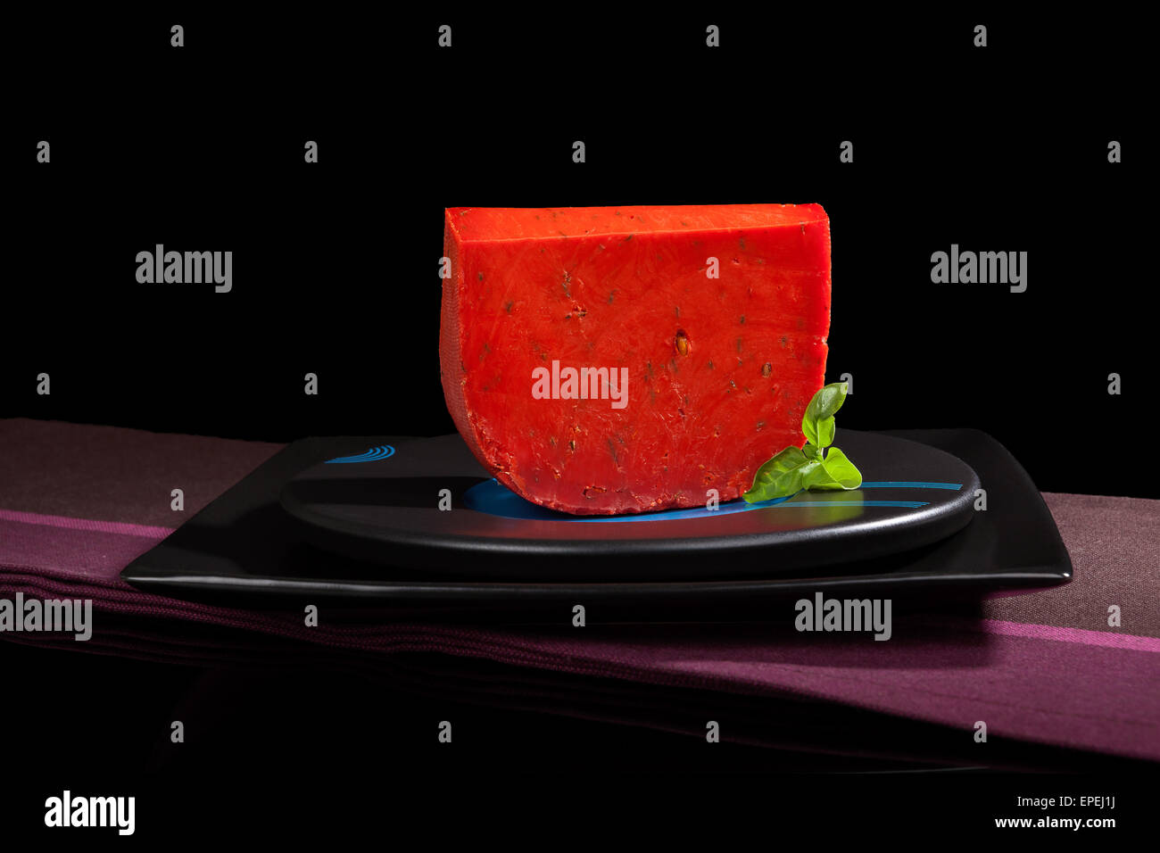 Red gouda cheese on black background. Culinary cheese eating Stock ...
