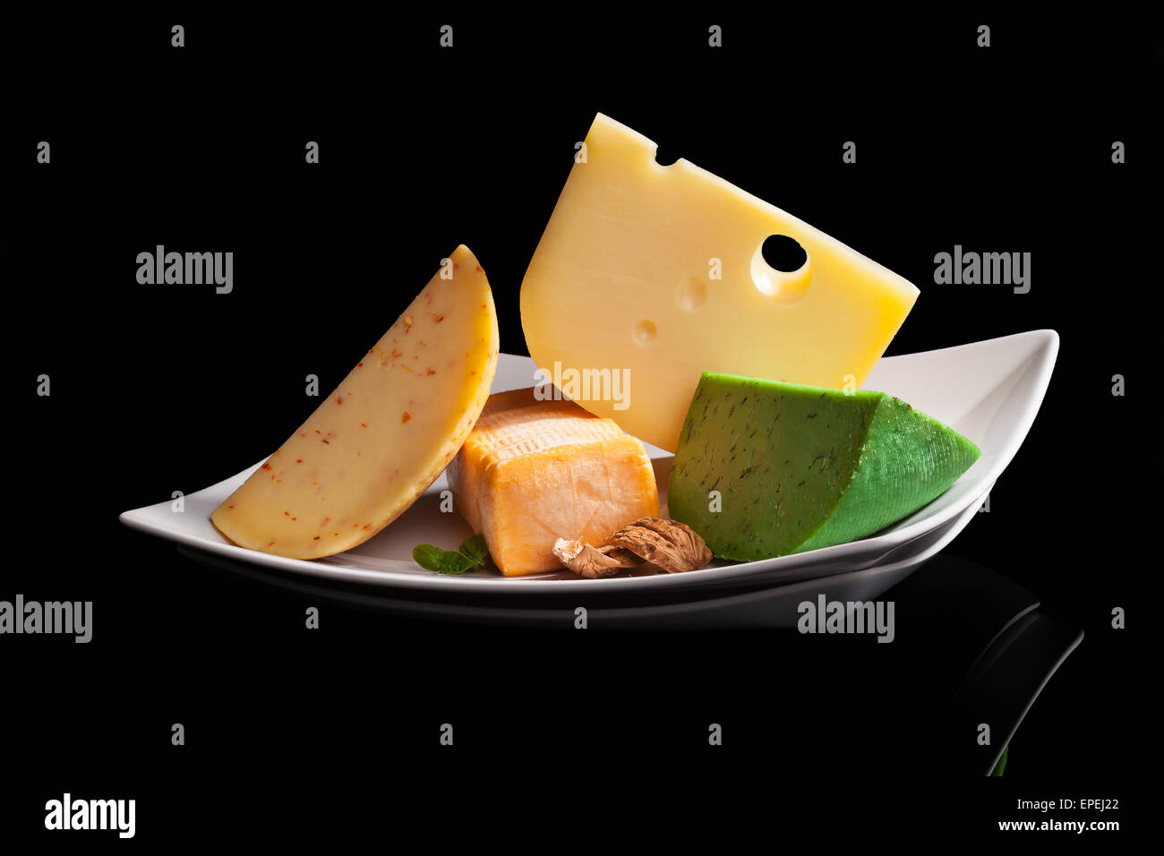 Colorful culinary cheese variation on black background. Gourmet cheese ...