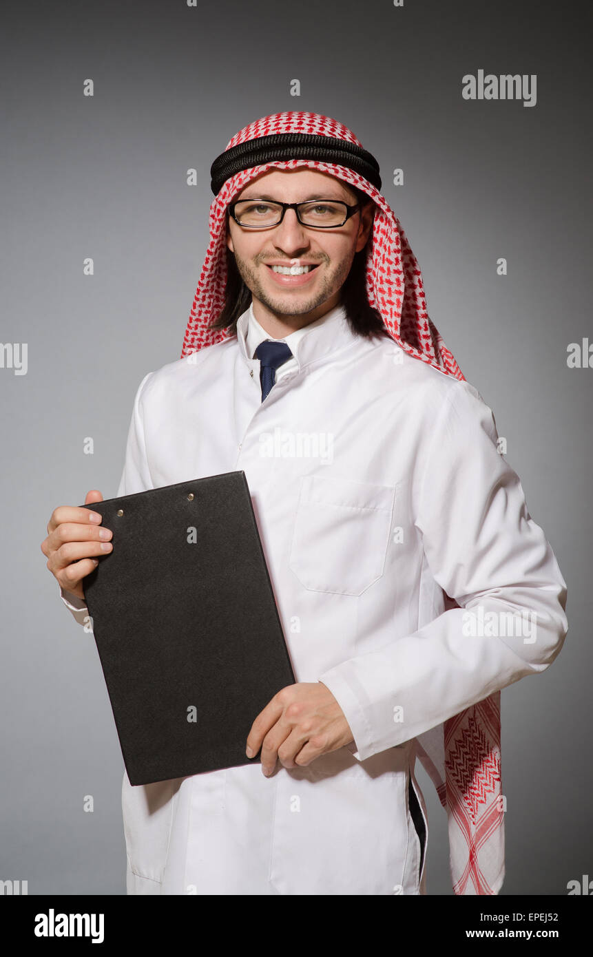 Arab man with paper binder Stock Photo - Alamy