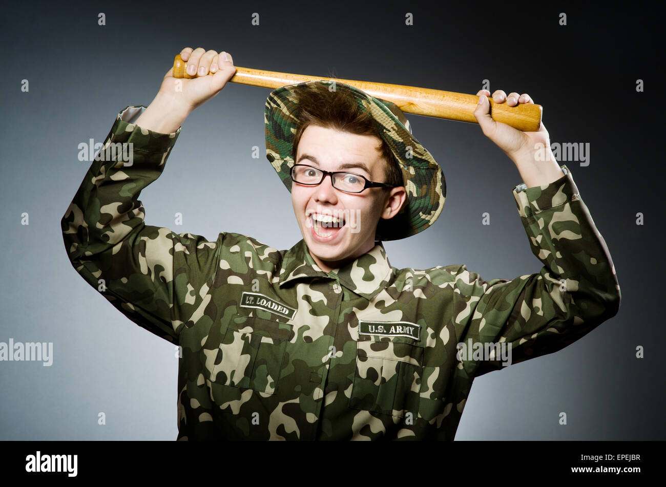 Funny soldier against the dark background Stock Photo - Alamy