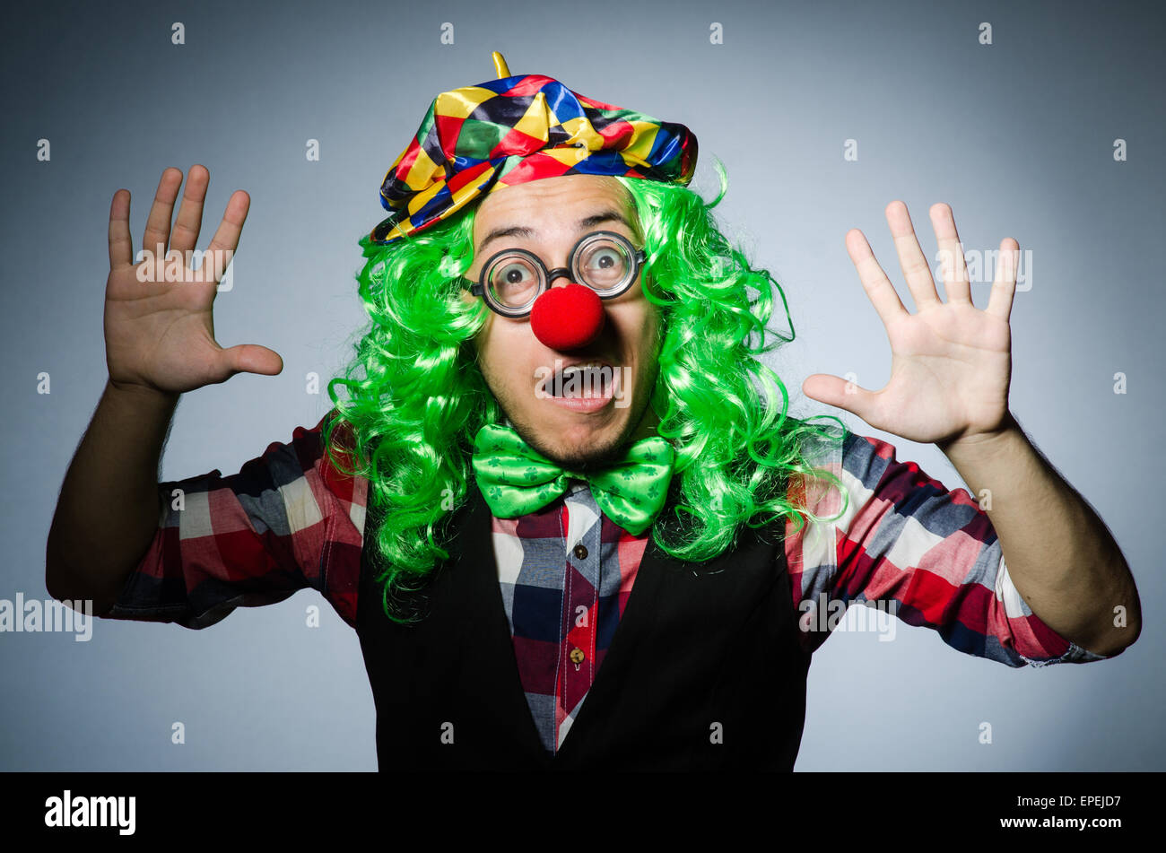 Funny clown against the dark background Stock Photo - Alamy