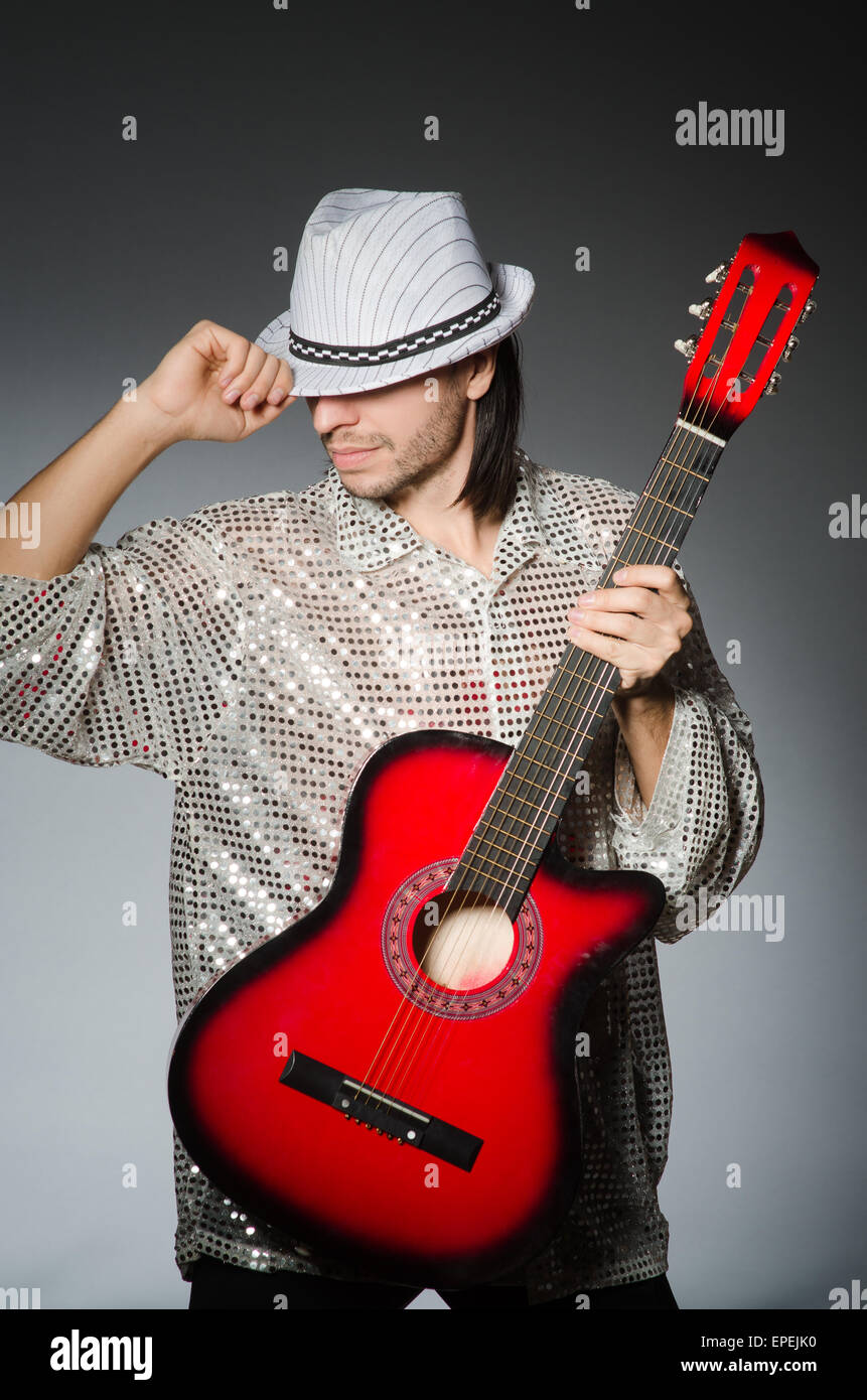 Man playing guitar during concert Stock Photo - Alamy