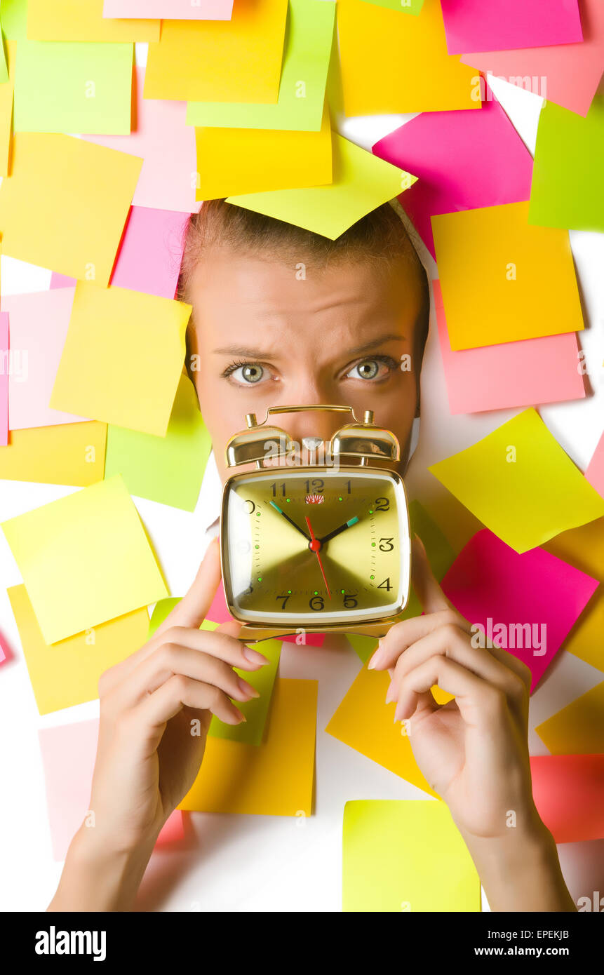 Woman with clock and lots of reminders Stock Photo - Alamy
