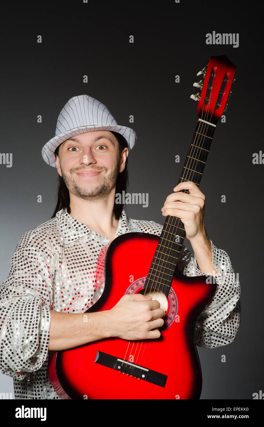 Man playing guitar during concert Stock Photo - Alamy