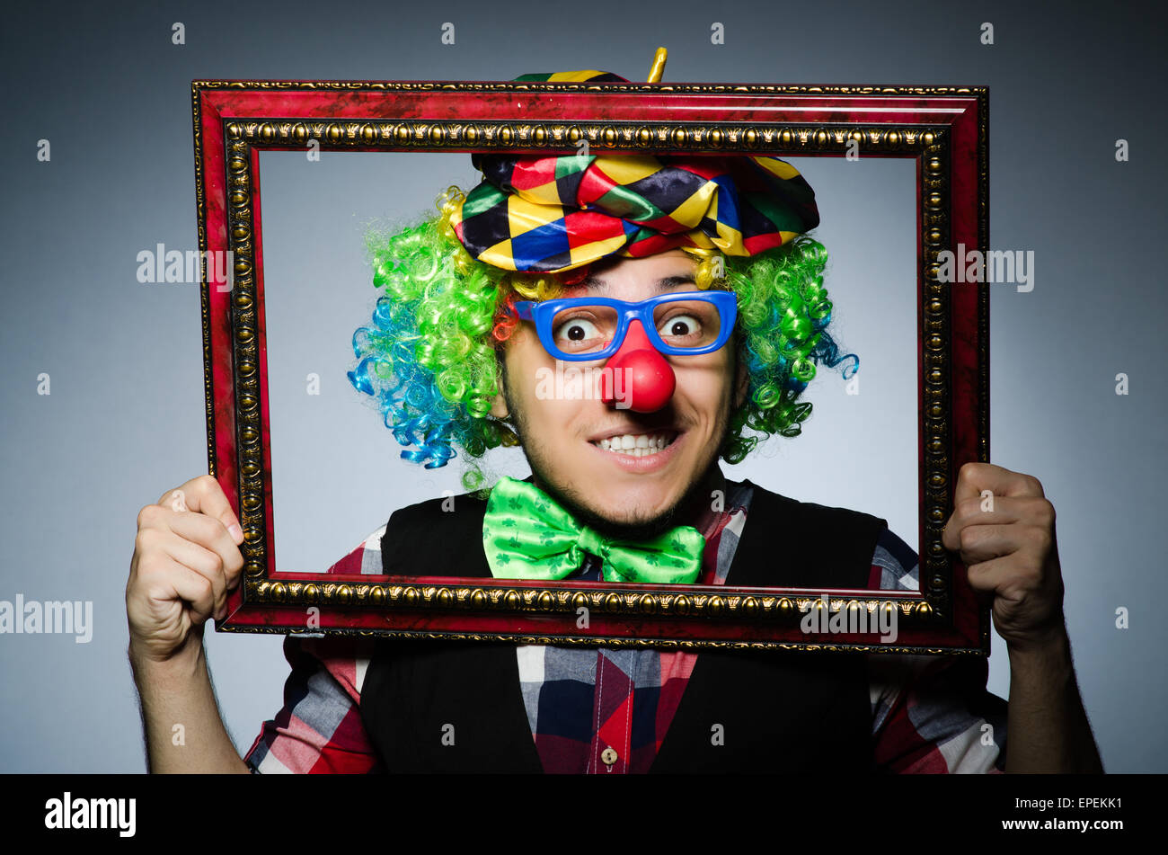 Funny clown with picture frame Stock Photo - Alamy