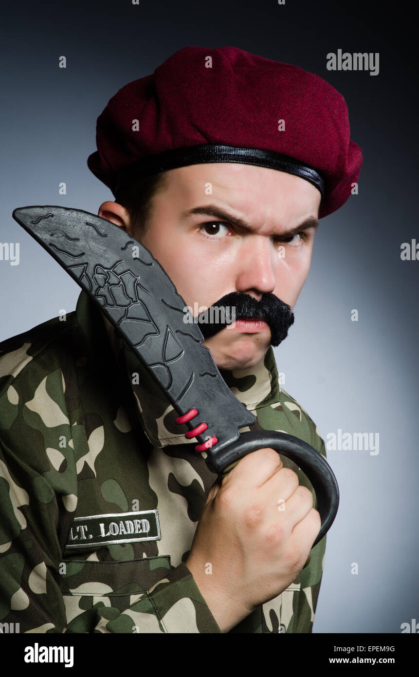 Funny soldier against the dark background Stock Photo - Alamy