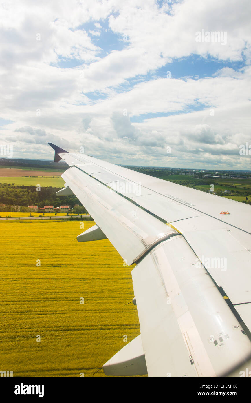 Airplane wing out of window Stock Photo - Alamy