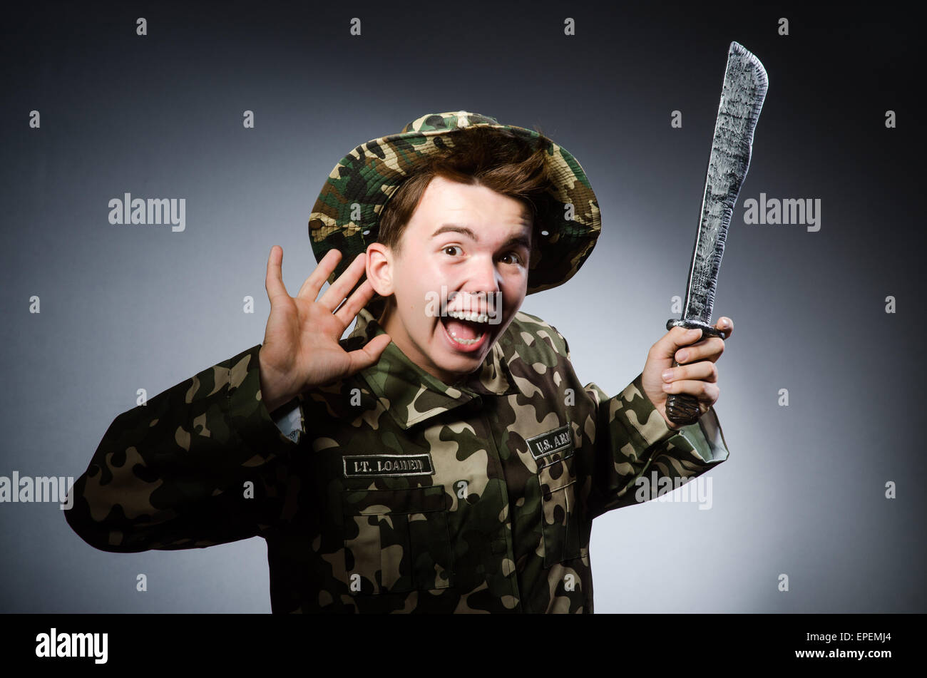 Funny soldier against the dark background Stock Photo - Alamy