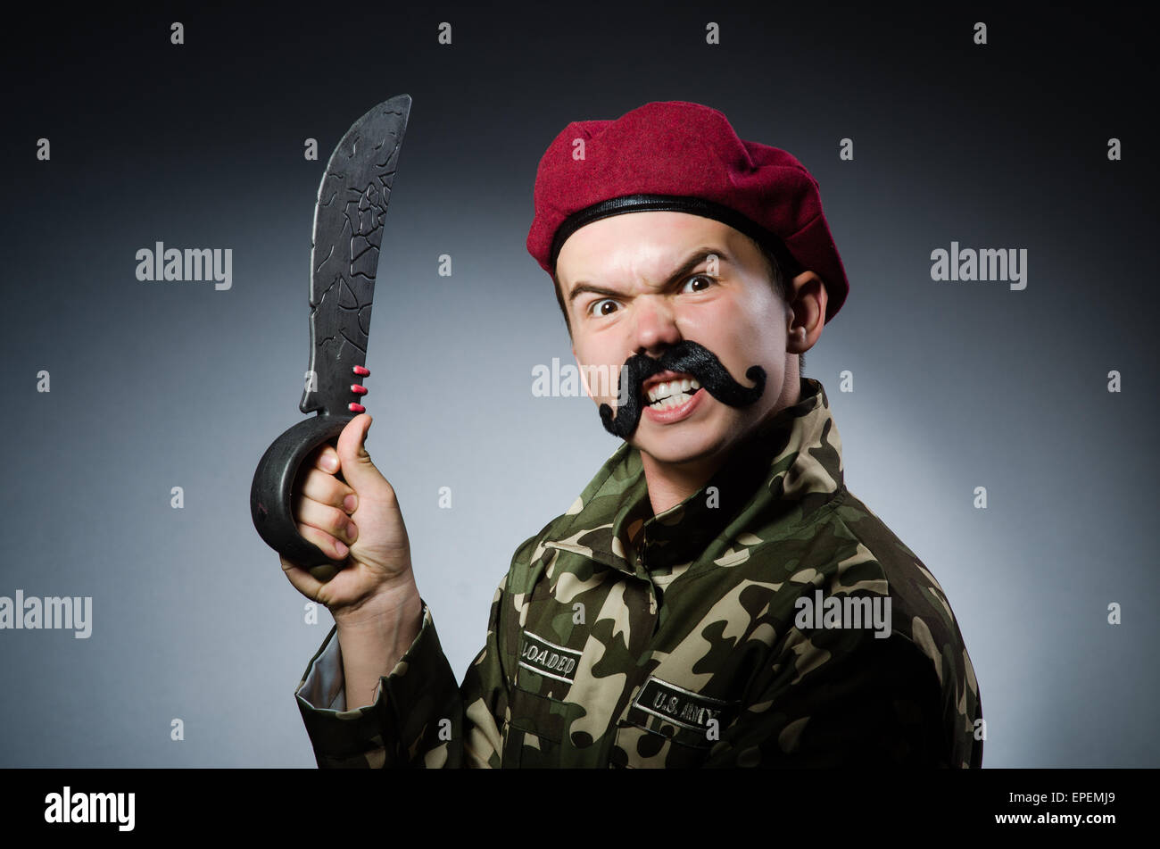 Funny soldier against the dark background Stock Photo - Alamy