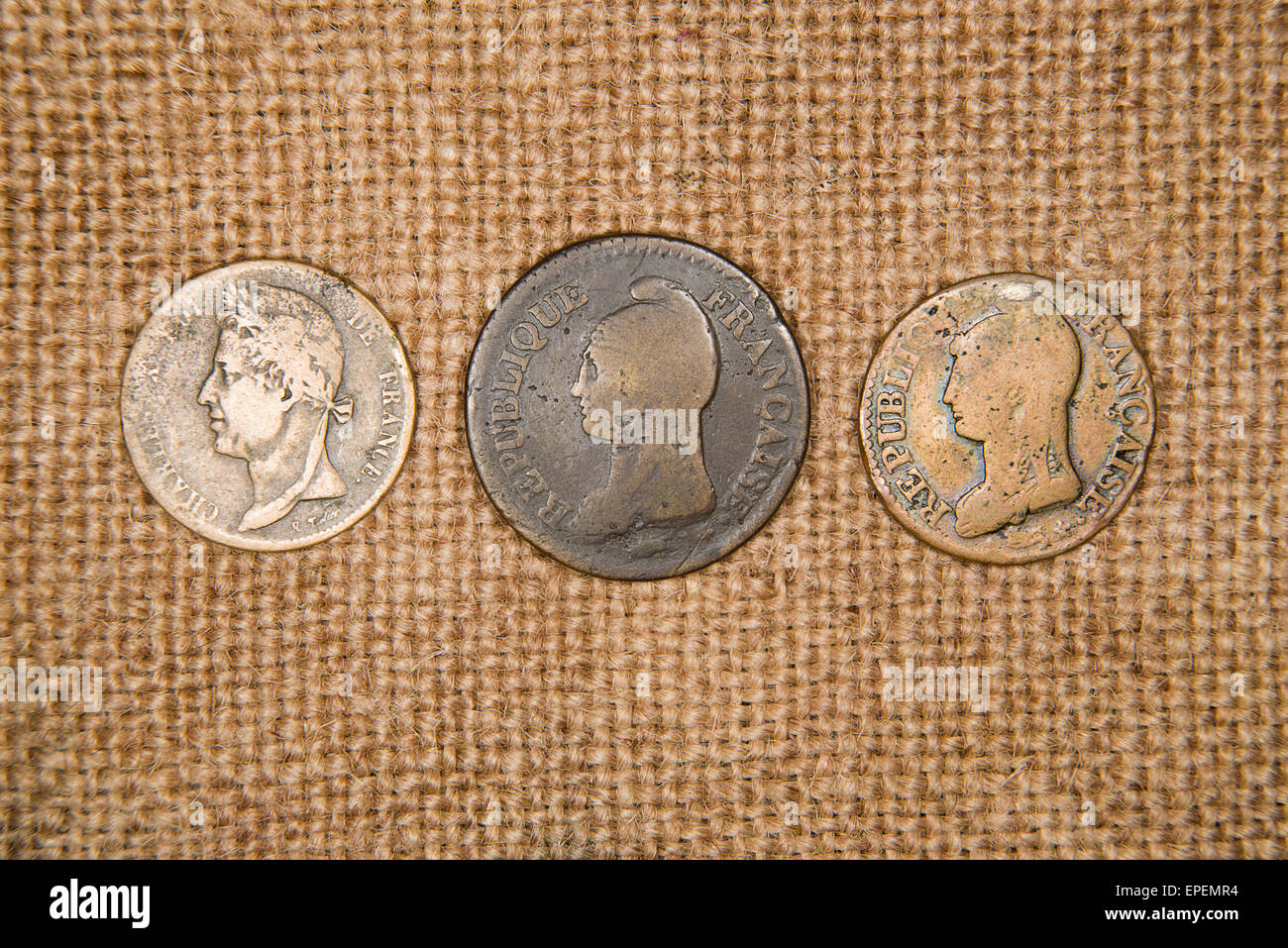 A lot of old coins with portraits on the old cloth Stock Photo - Alamy