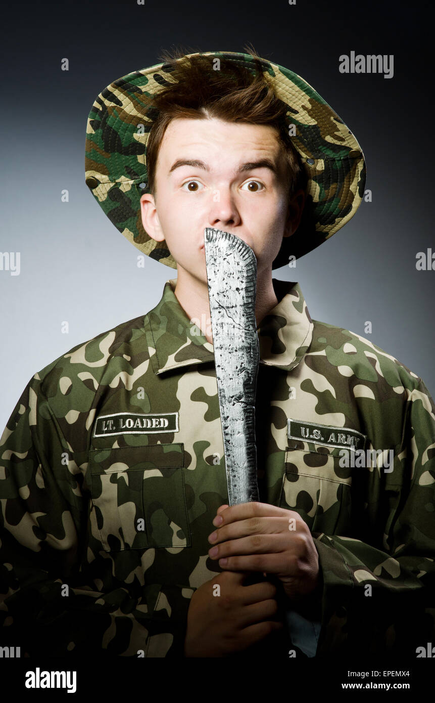 Funny soldier against the dark background Stock Photo - Alamy