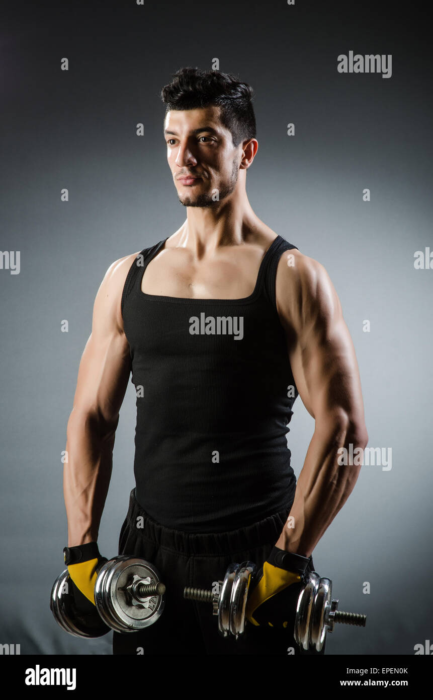 Muscular ripped bodybuilder with dumbbells Stock Photo - Alamy