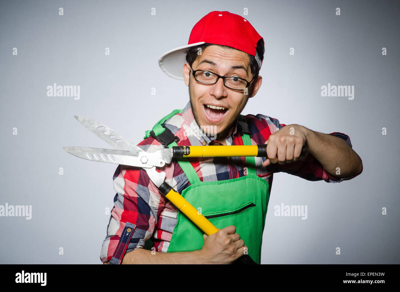 Funny man with giant shears Stock Photo - Alamy