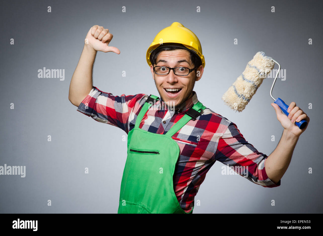 Funny painter with hardhat and roller Stock Photo - Alamy