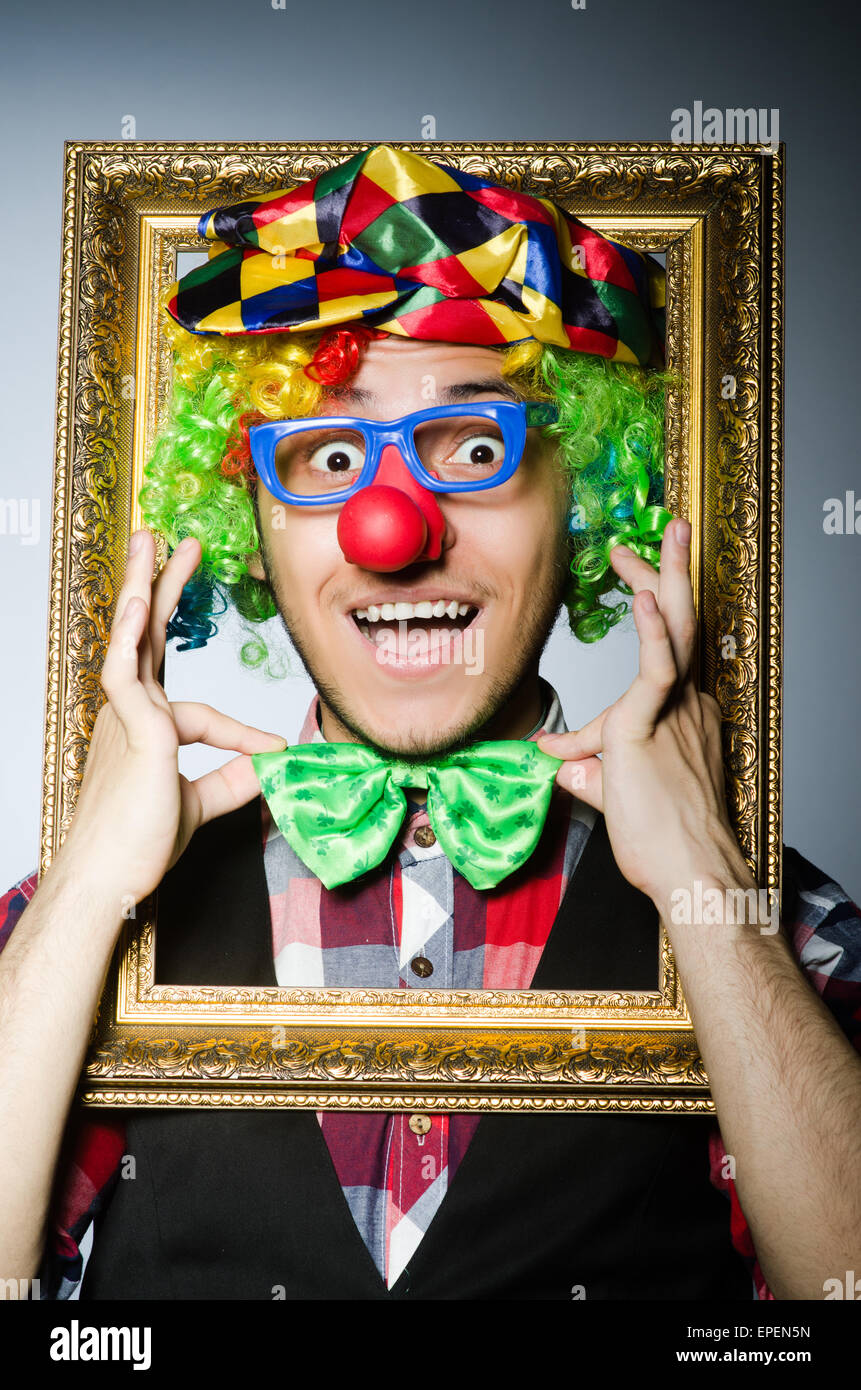Funny clown with picture frame Stock Photo - Alamy