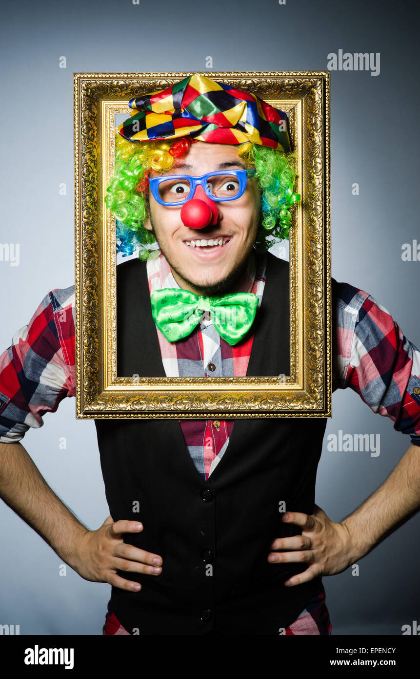 Funny clown with picture frame Stock Photo - Alamy