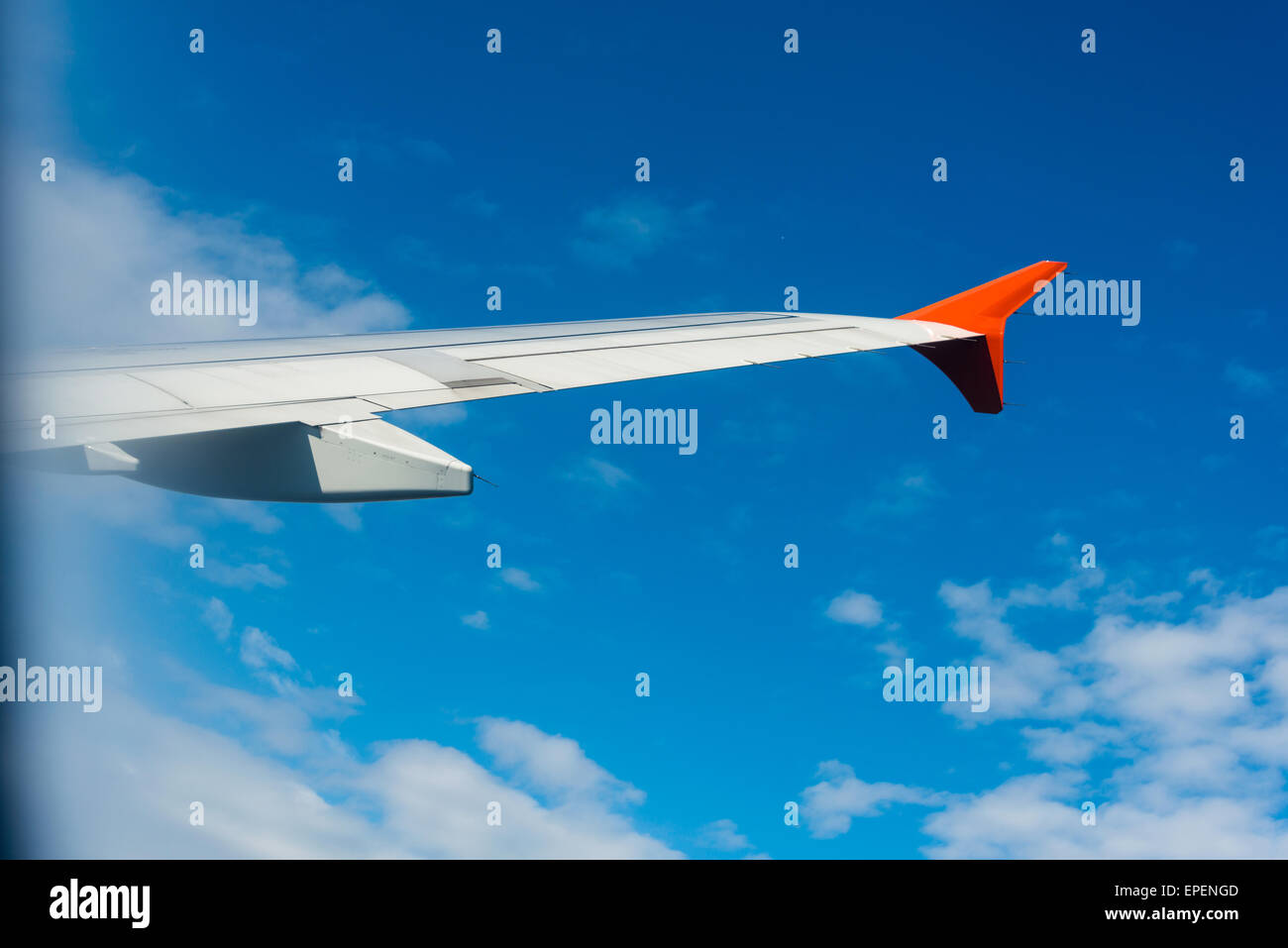 Airplane wing out of window Stock Photo - Alamy