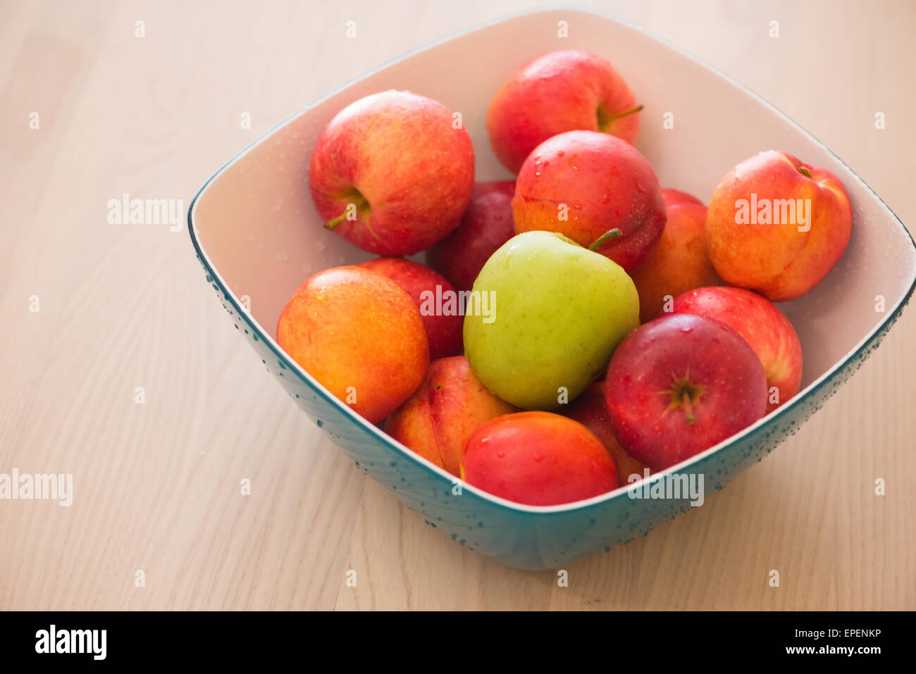 Fruits in the bown on table Stock Photo - Alamy