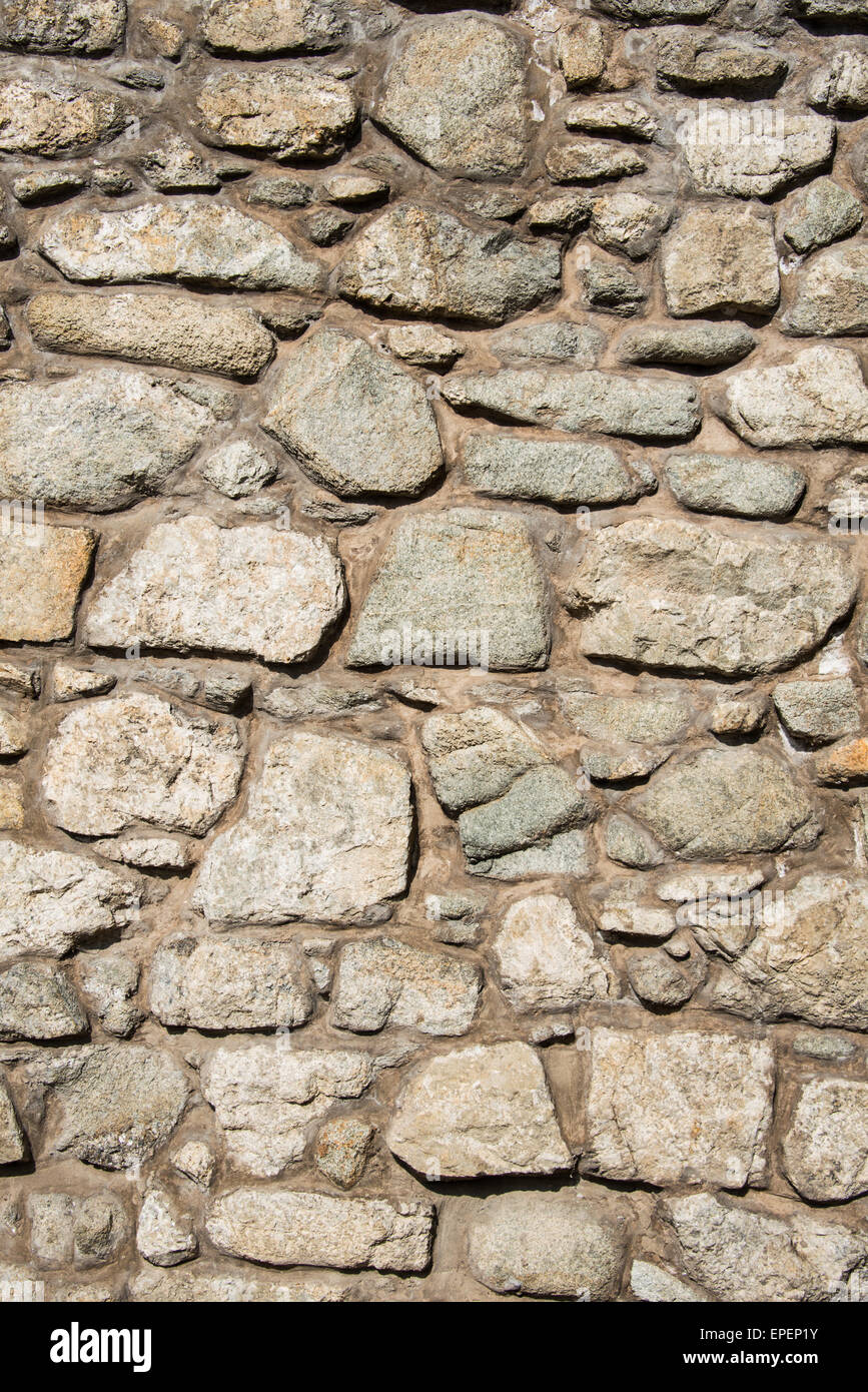 Wall made of various stones Stock Photo - Alamy
