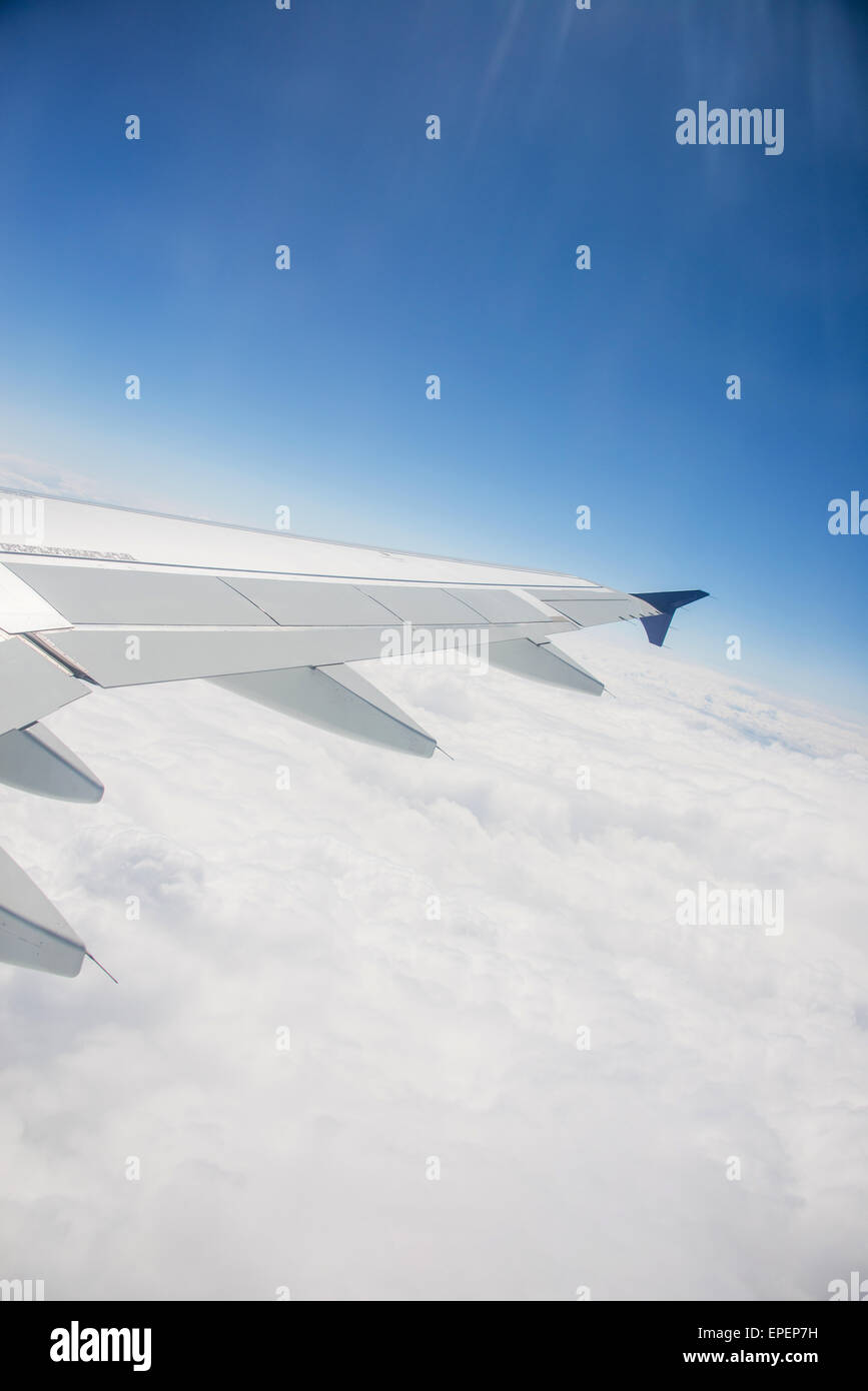 Airplane wing out of window Stock Photo - Alamy