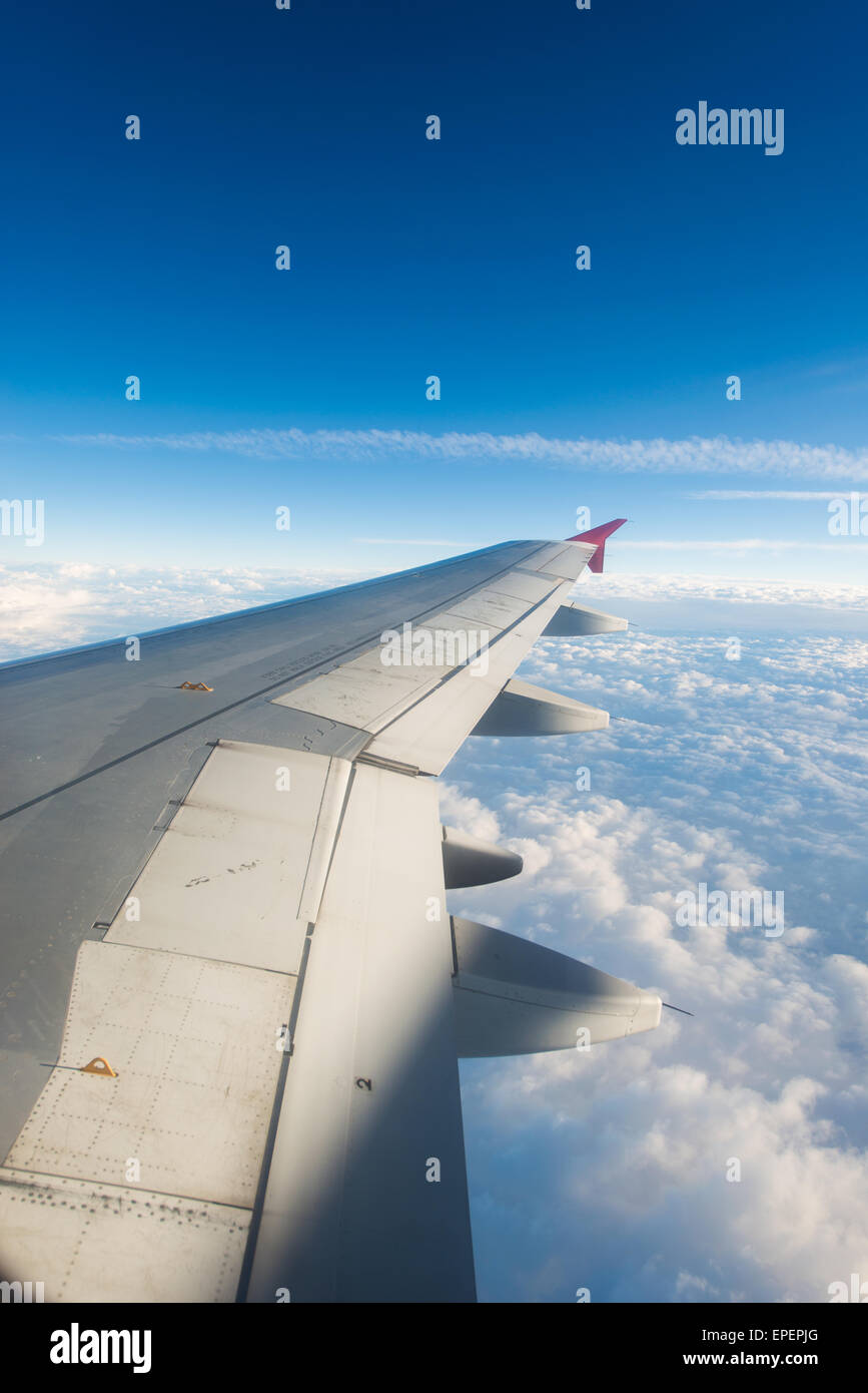 Airplane wing out of window Stock Photo - Alamy