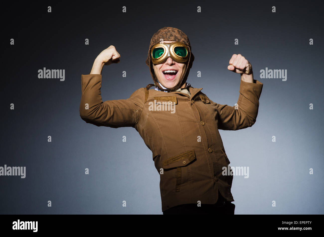 Funny pilot with goggles and helmet Stock Photo - Alamy