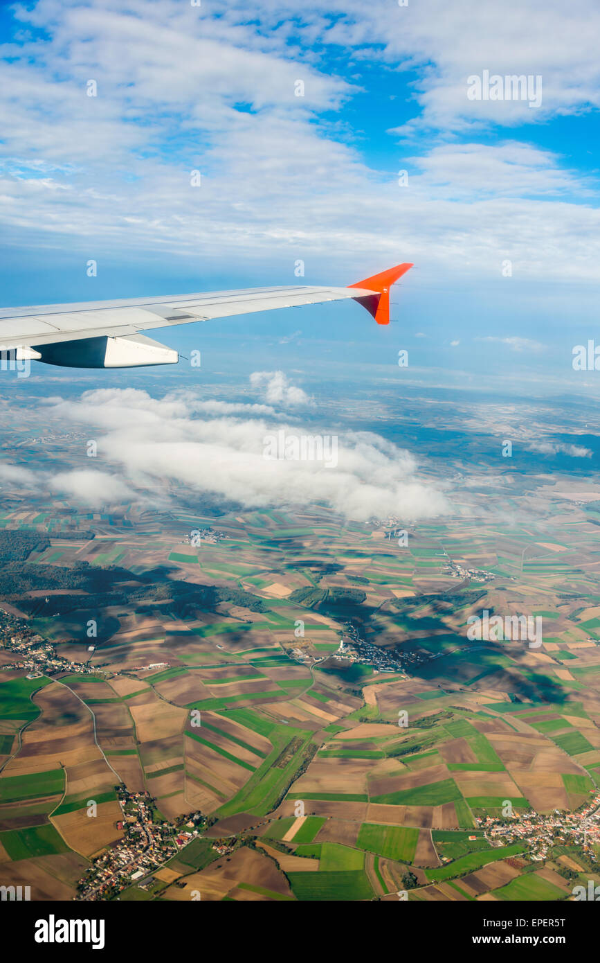 Airplane wing out of window Stock Photo - Alamy
