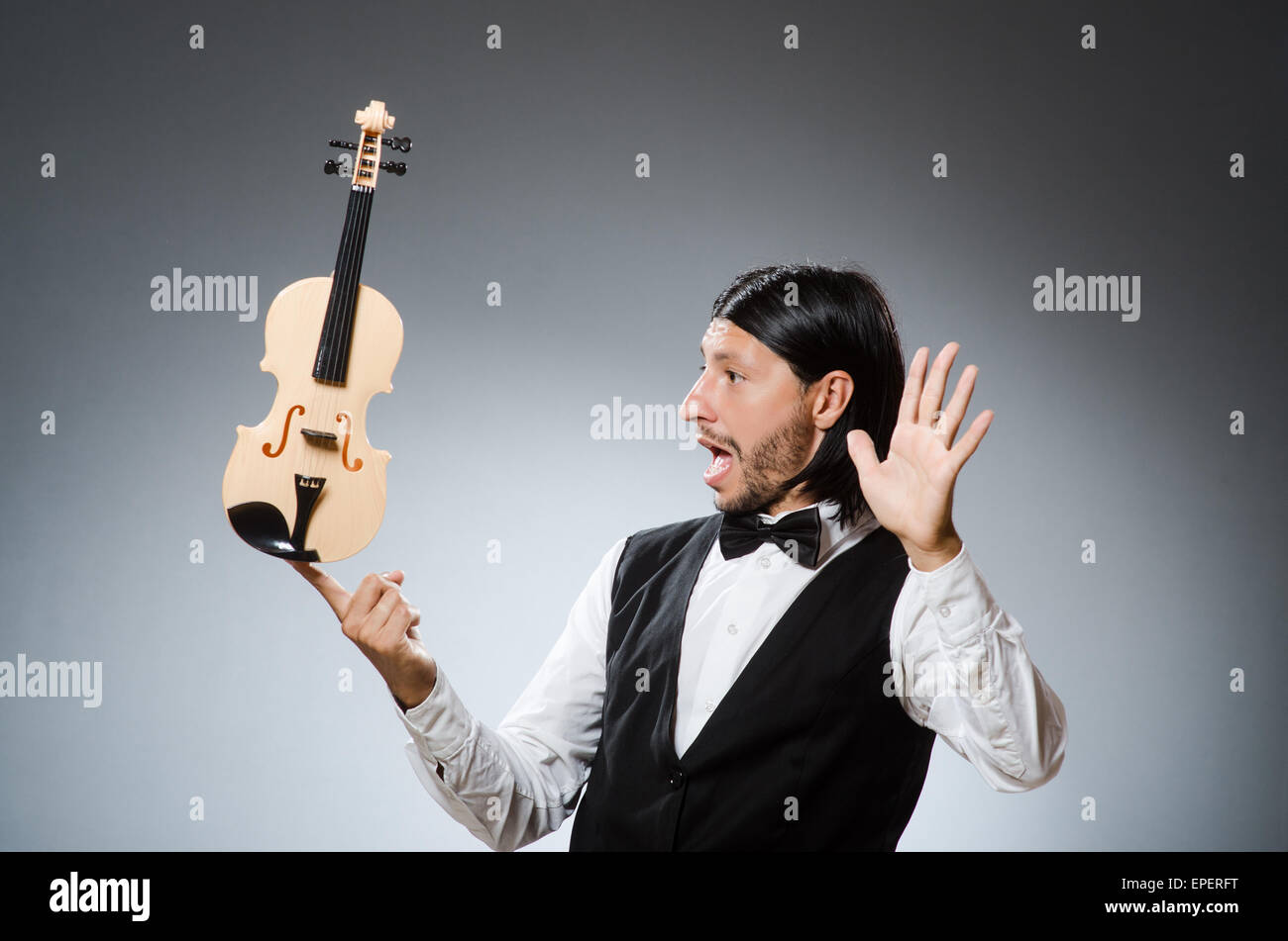 Funny fiddle violin player in musical concept Stock Photo - Alamy