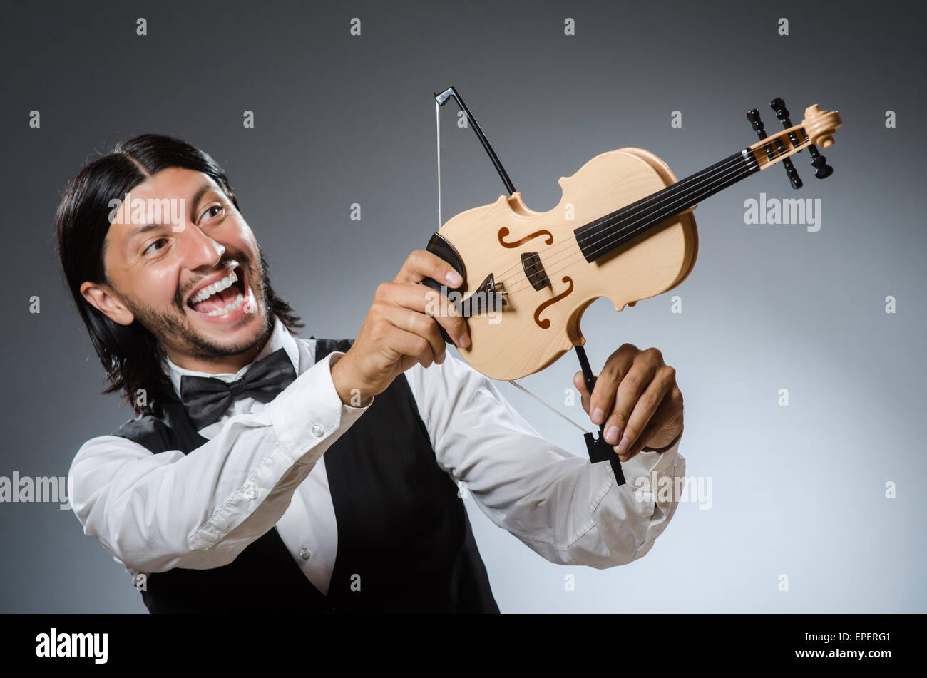 Funny fiddle violin player in musical concept Stock Photo - Alamy