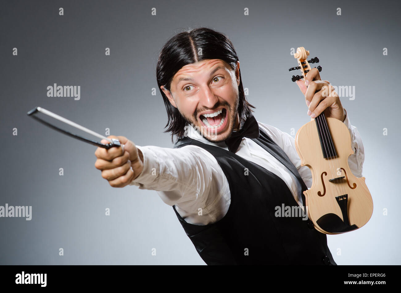 Funny fiddle violin player in musical concept Stock Photo - Alamy