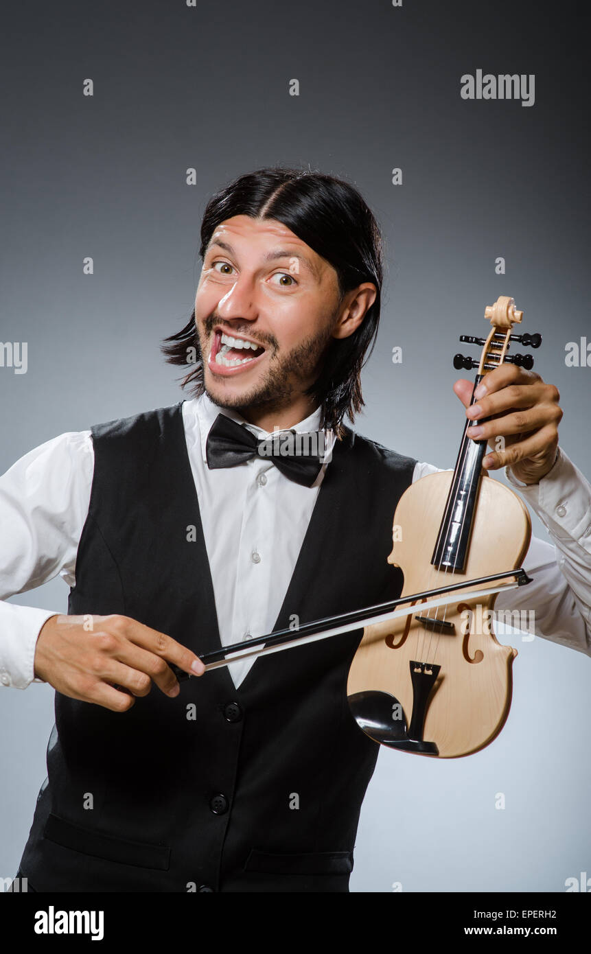 Funny fiddle violin player in musical concept Stock Photo - Alamy