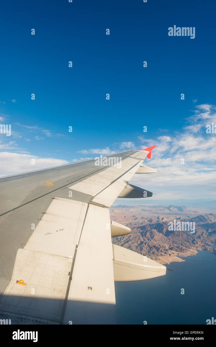 Airplane wing out of window Stock Photo - Alamy