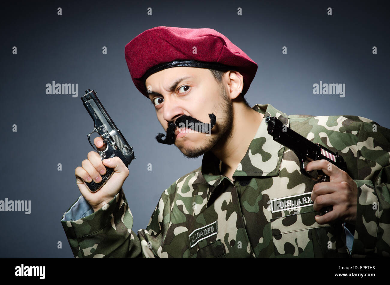 Funny soldier against the dark background Stock Photo - Alamy
