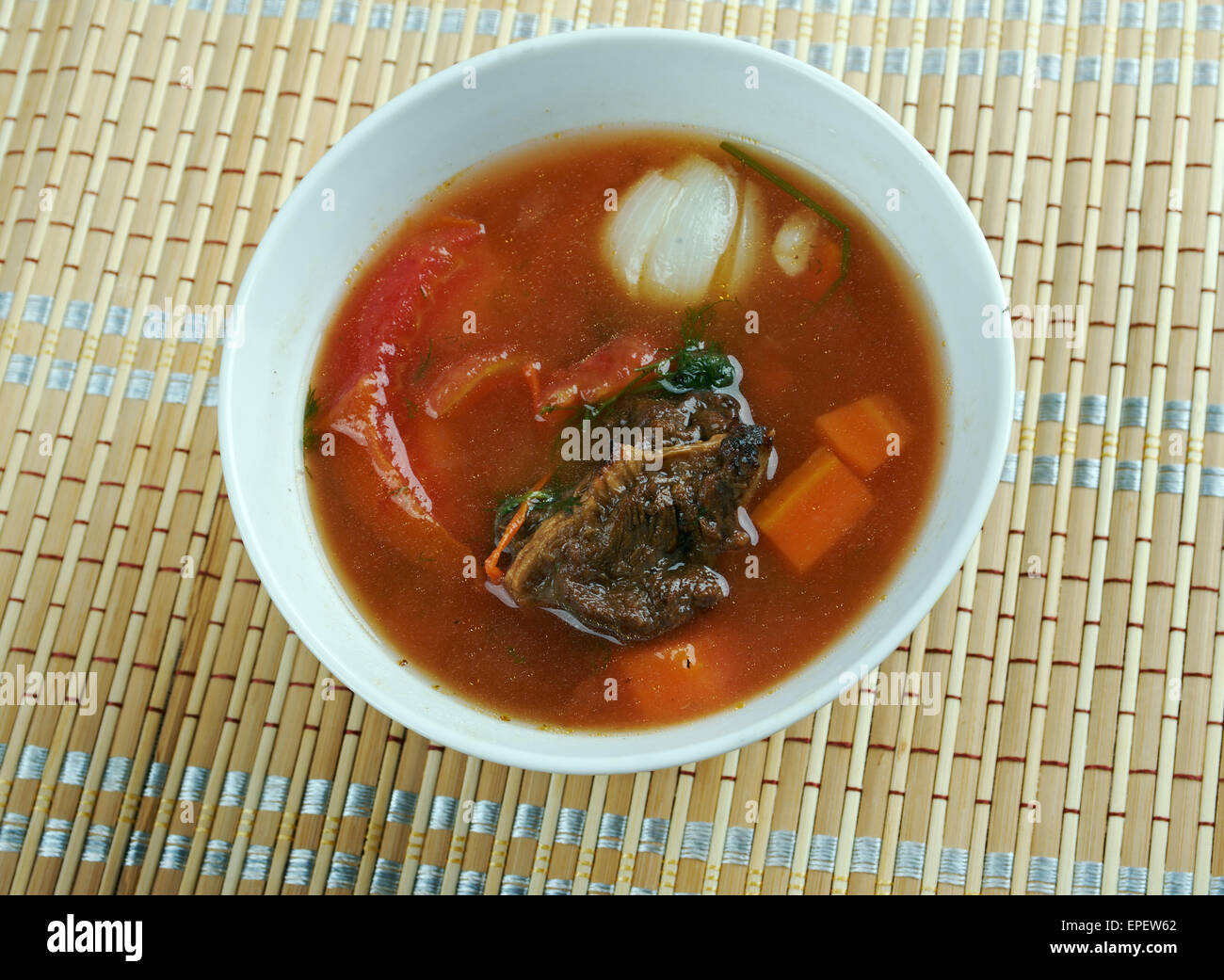 shurpa chaban - Uzbek cuisine . lamb soup with tomatoes Stock Photo - Alamy