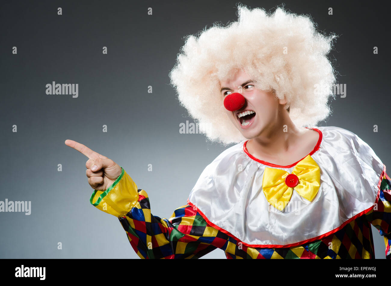 Funny clown in the studio Stock Photo - Alamy
