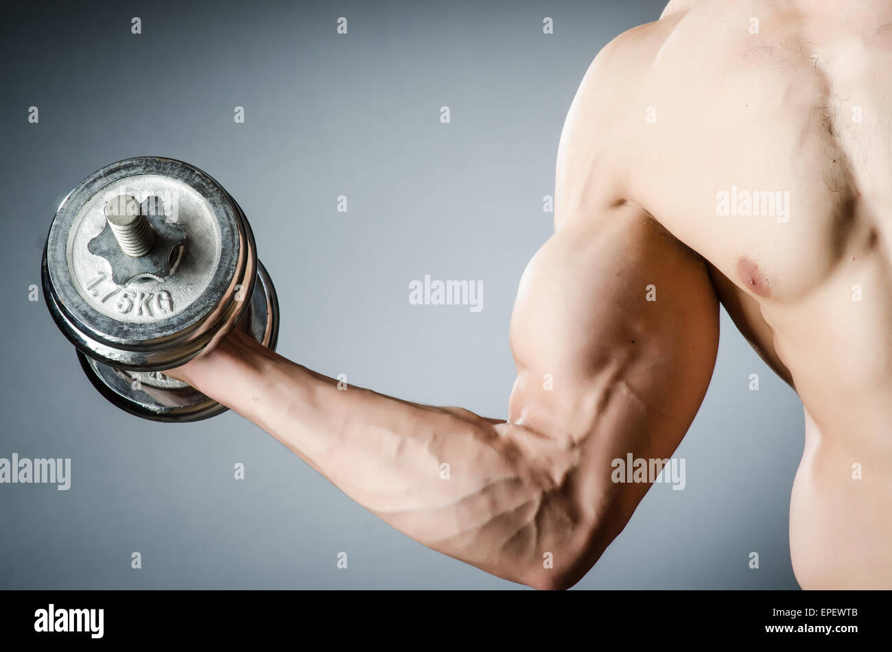 Muscular ripped bodybuilder with dumbbells Stock Photo - Alamy
