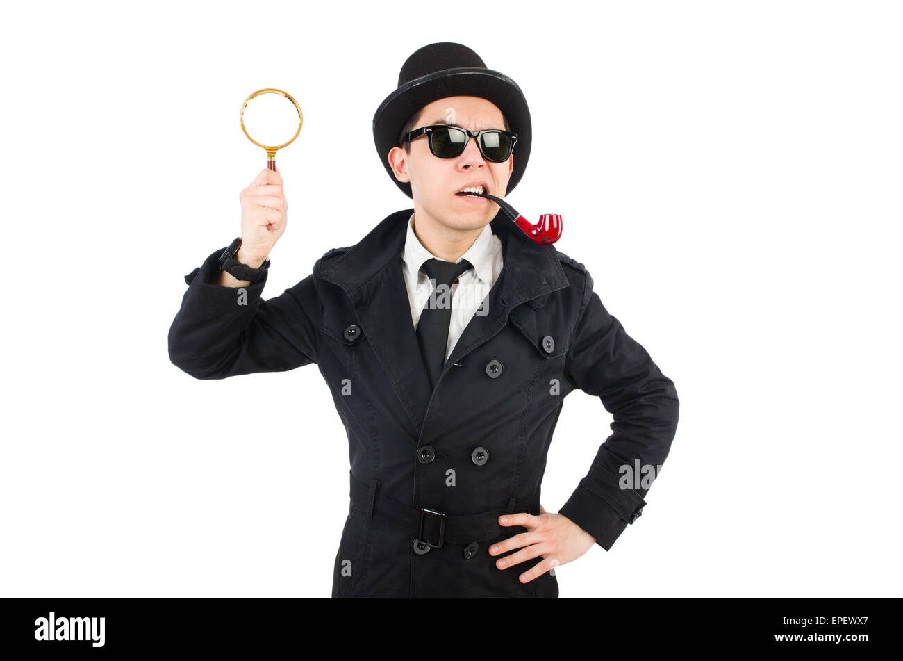 Young detective with pipe and magnifying glass Stock Photo - Alamy