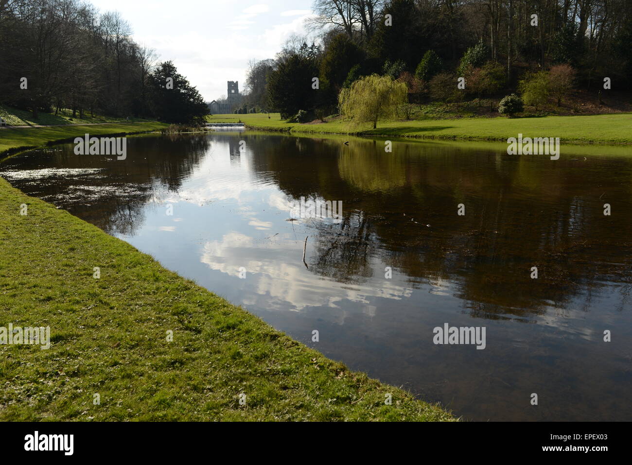 Fountains Abbey in the distance viewpoint from Studley Royal Water ...