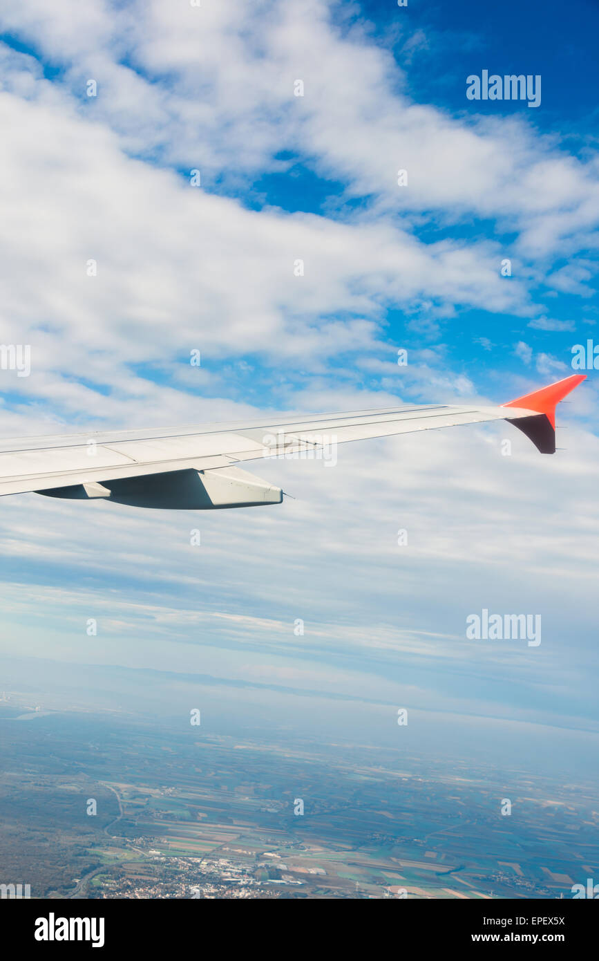 Airplane wing out of window Stock Photo - Alamy