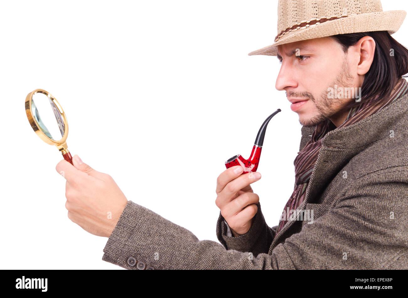 Young detective with pipe and magnifying glass Stock Photo - Alamy